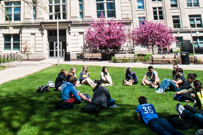 University of Iowa students taking a class outside on the Pentacrest in ...